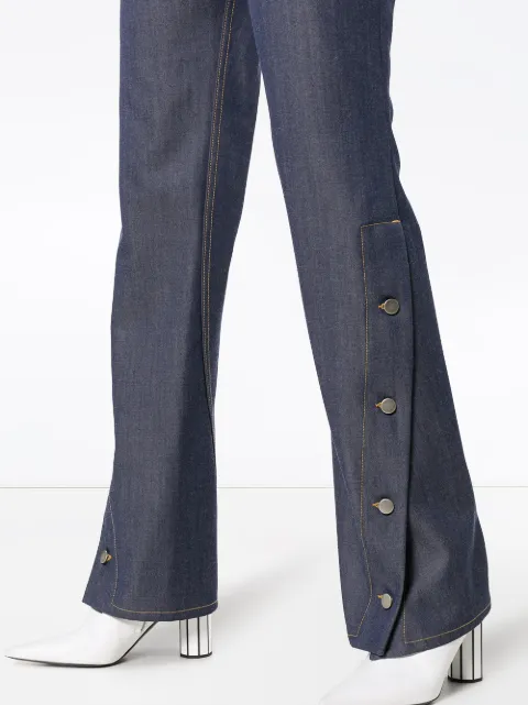 Shop Wright Le Chapelain button detail flared jeans with Express ...