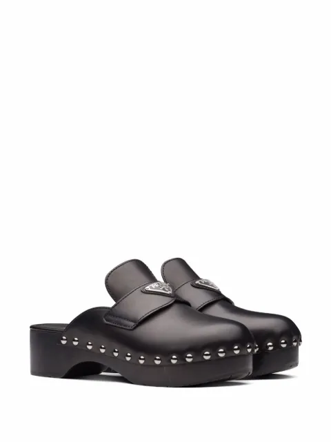 Prada triangle logo studded clogs - FARFETCH