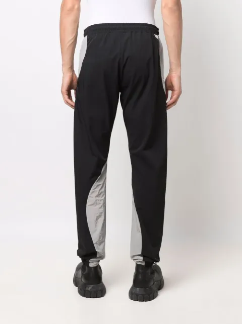 Shop HELIOT EMIL colour-block rubber-strap track pants with Express ...