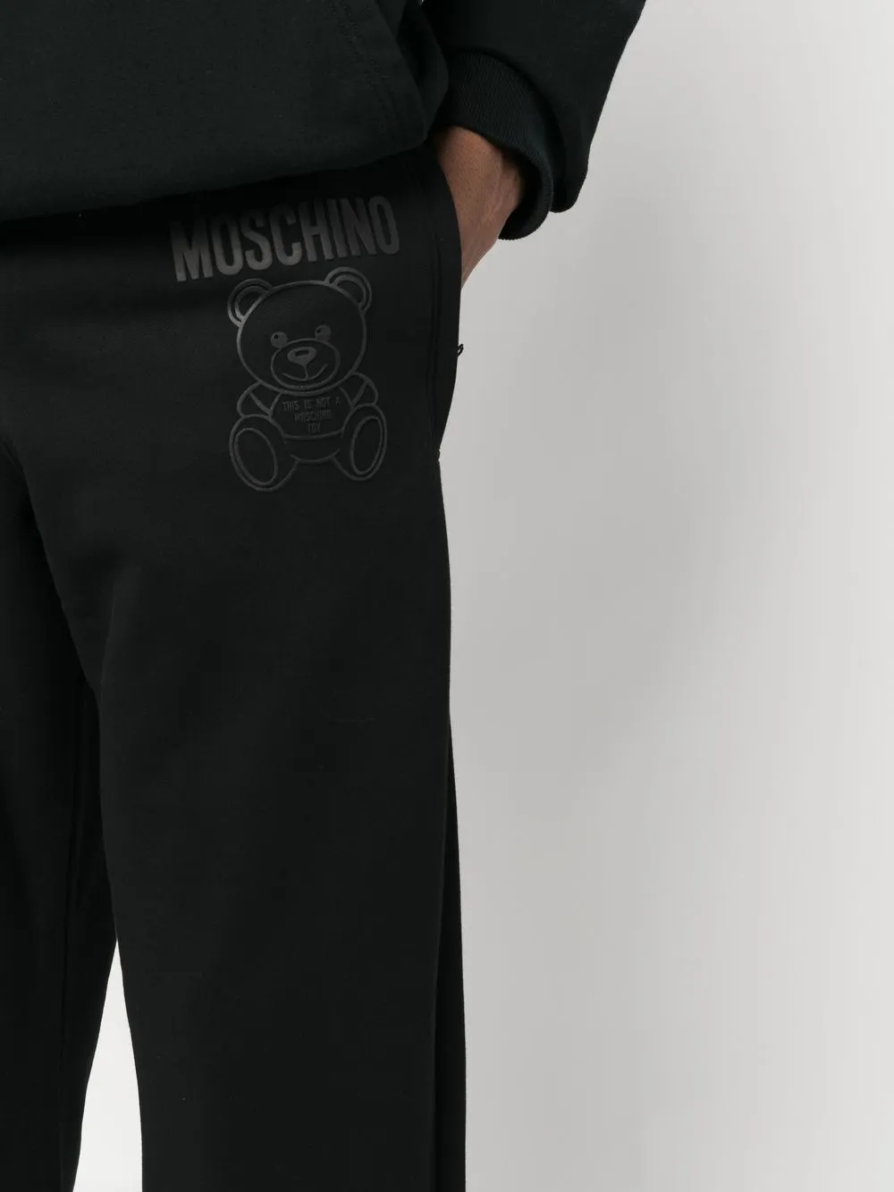 Moschino logo-print Detail Trousers - Farfetch